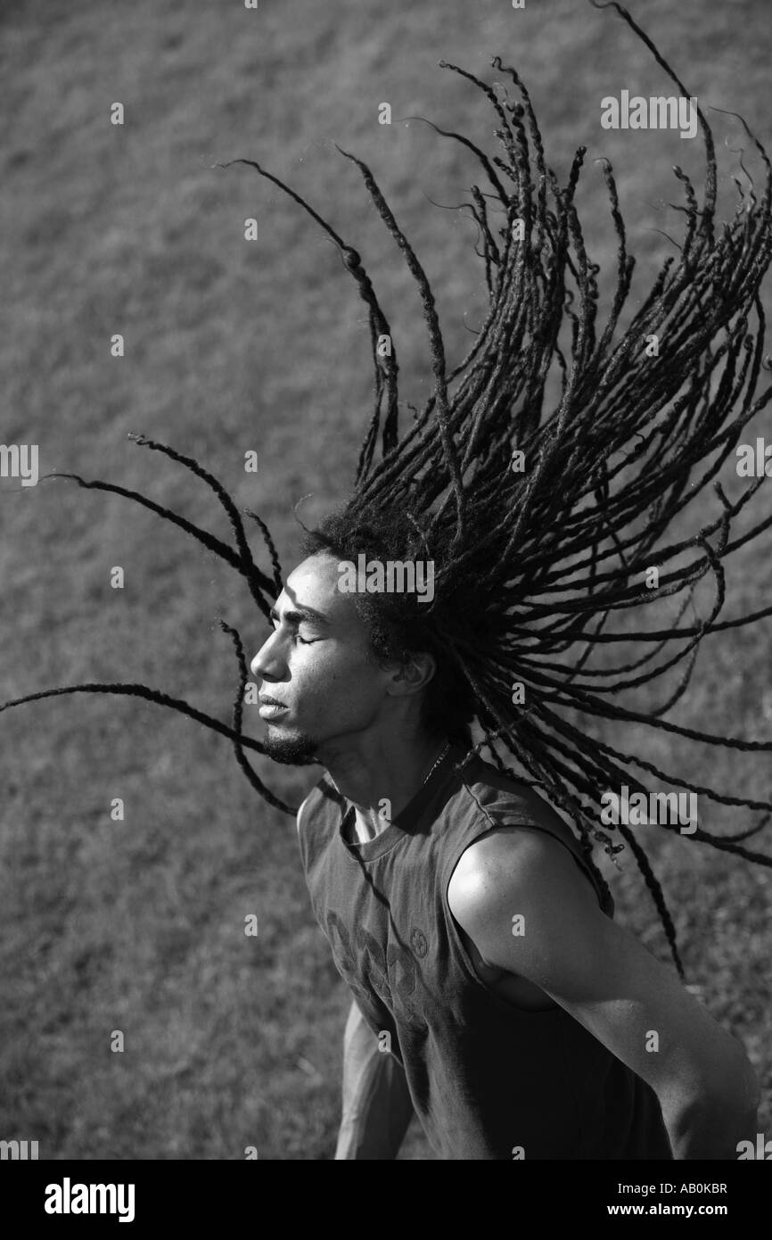 Man dancing with dreadlocks flying in the air Stock Photo - Alamy