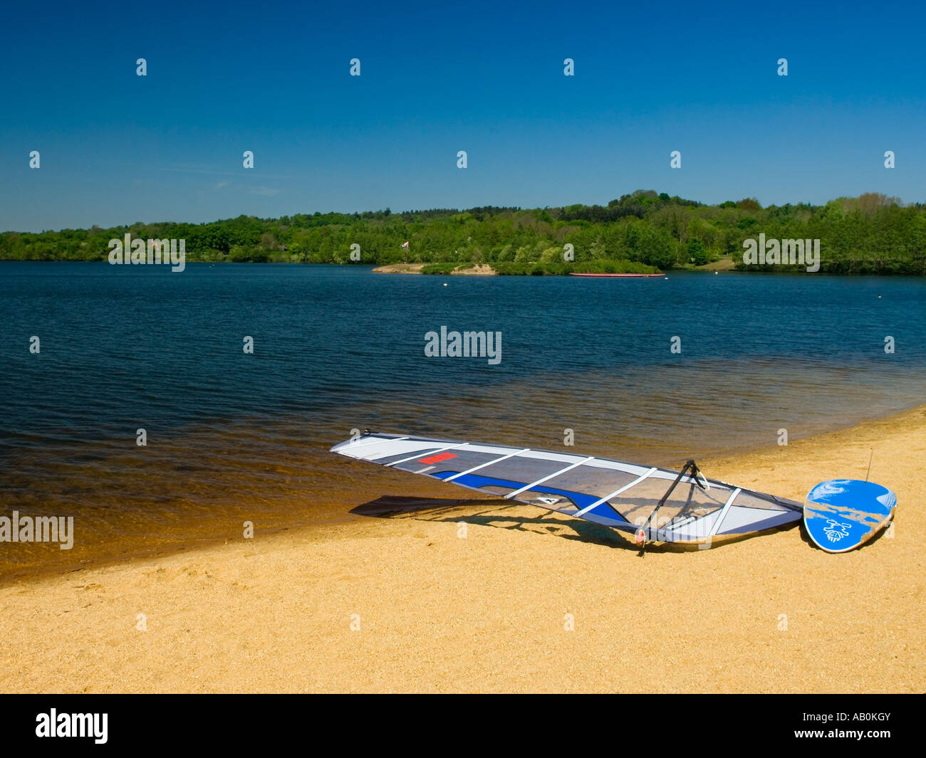Windsurfing board lying on the beach of Horseshoe Lake in Trilakes ...