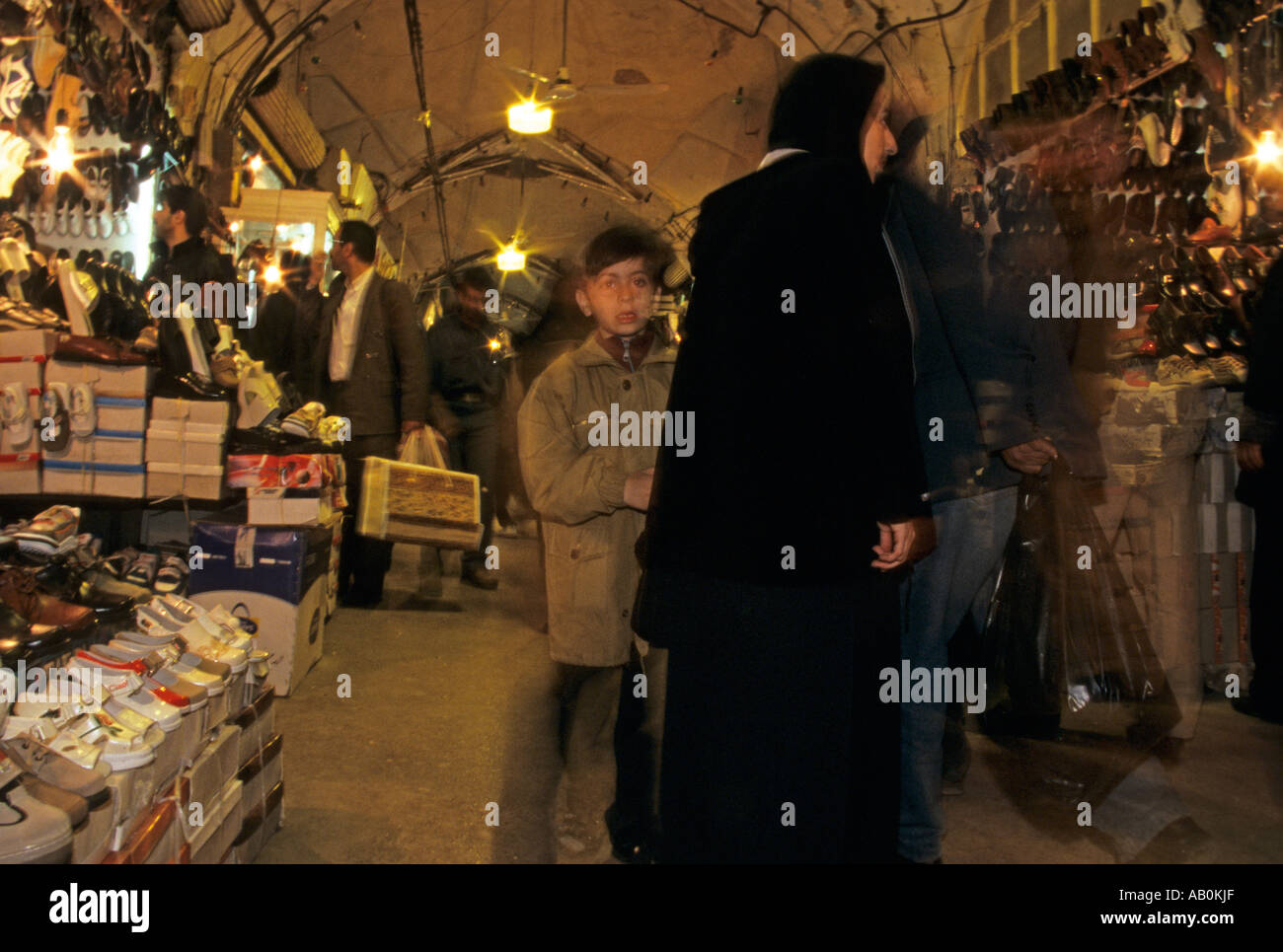 Shoe shops line an alley at a bazaar in Tehran Iran Stock Photo - Alamy