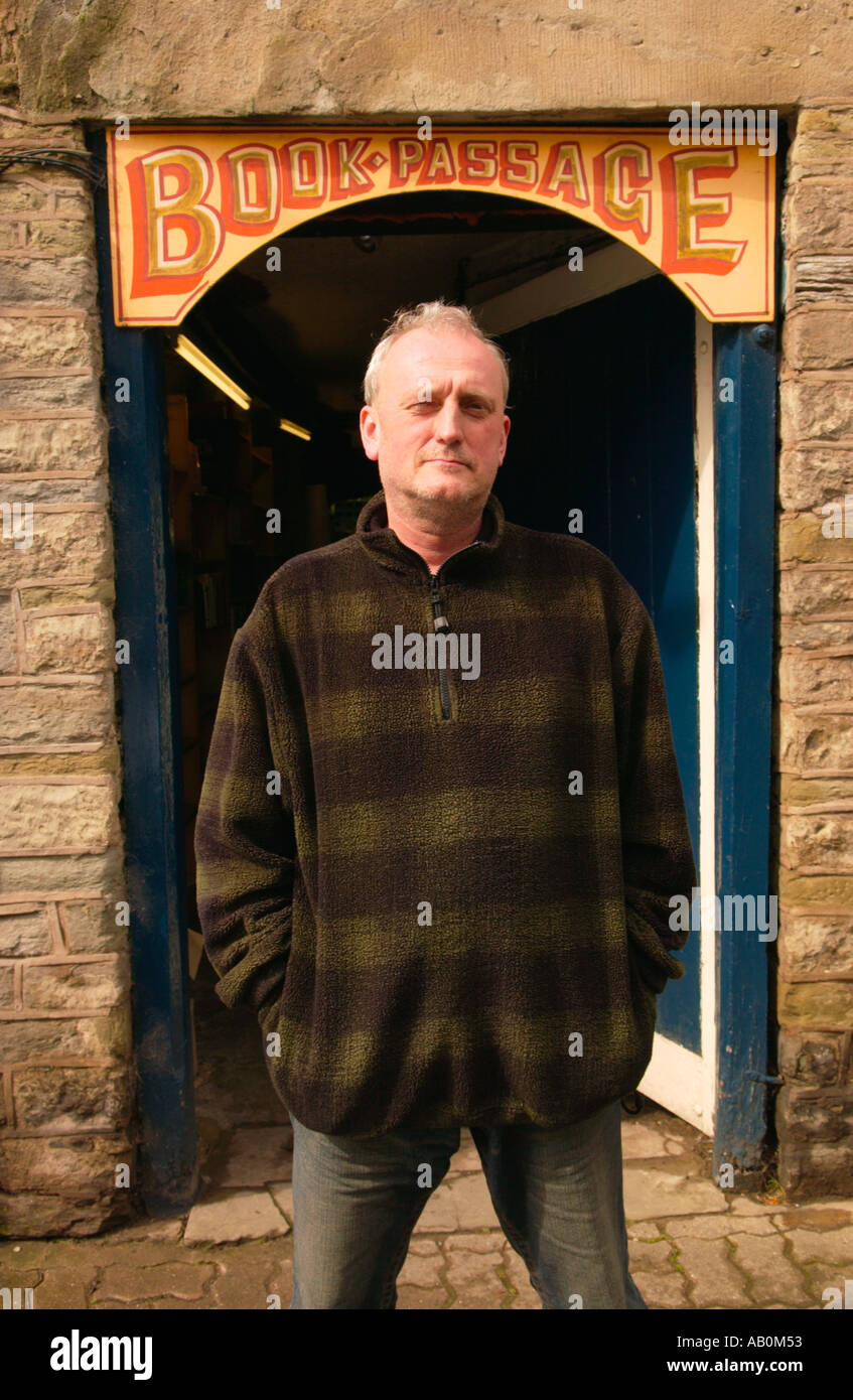 Derek Addyman outside one of his bookshops at Hay on Wye Powys Wales UK ...