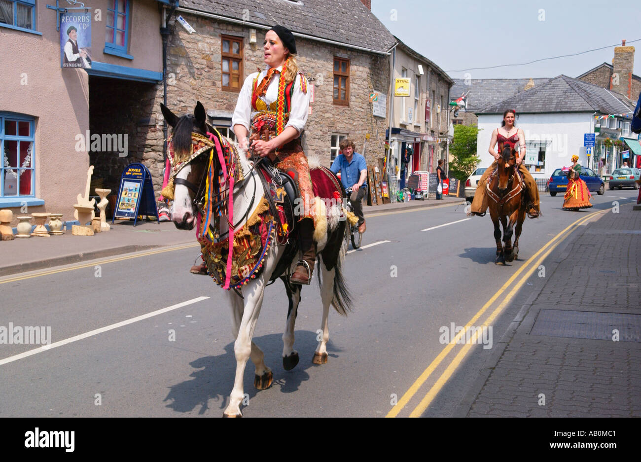 Performers from Giffords Circus ride on horseback through streets as ...