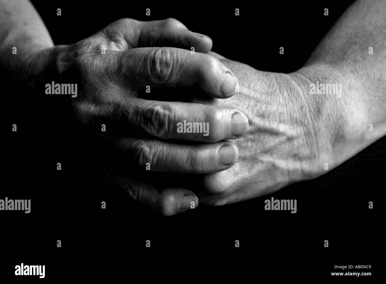 one hand holding the other Stock Photo - Alamy