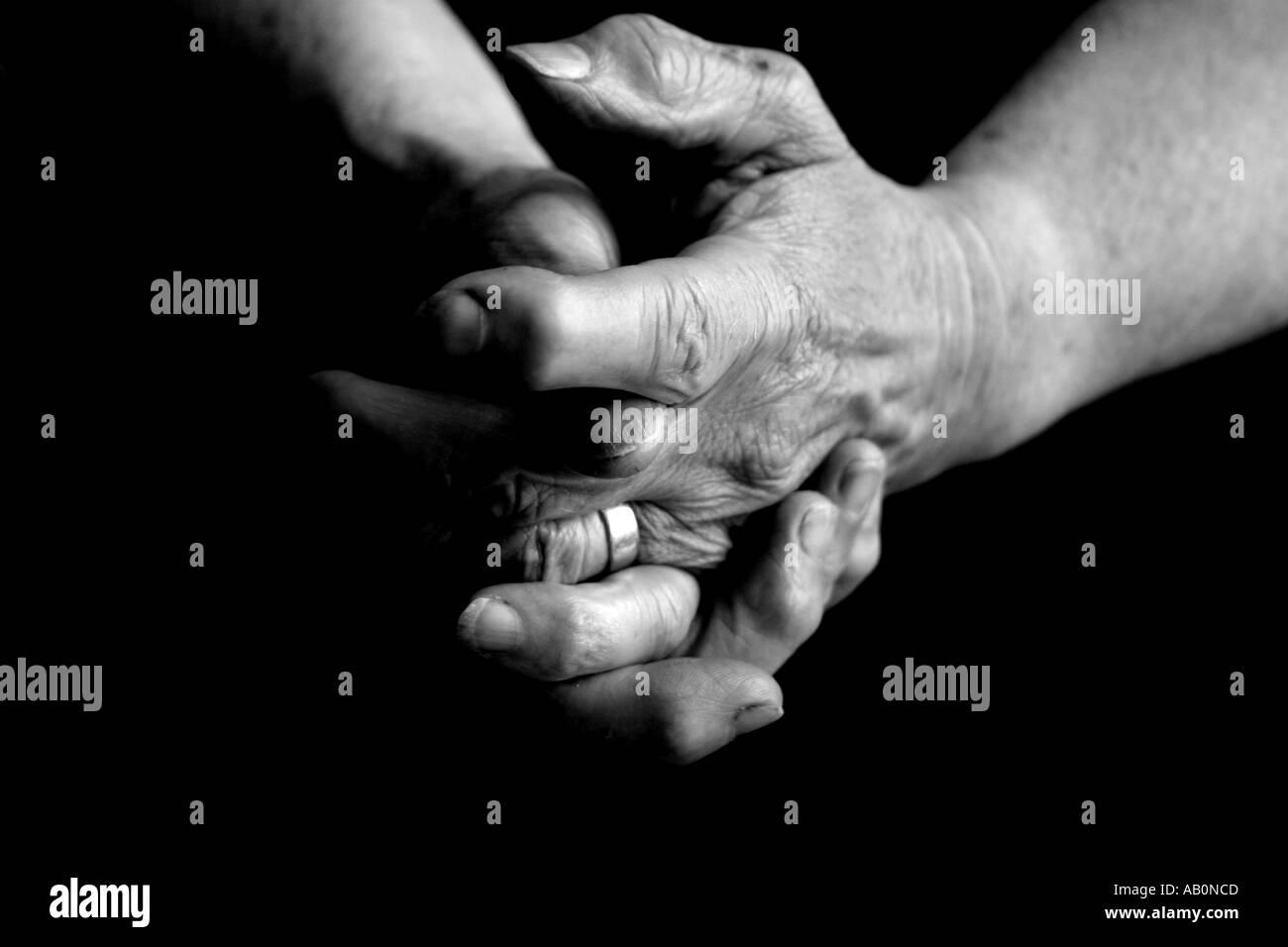 one hand in other Stock Photo - Alamy