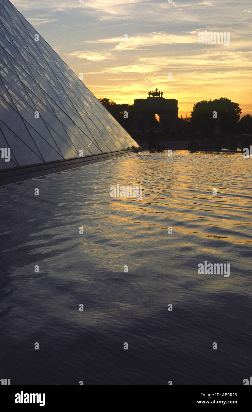 Sunset at the glass pyramid at the Louvre in Paris France Stock Photo ...