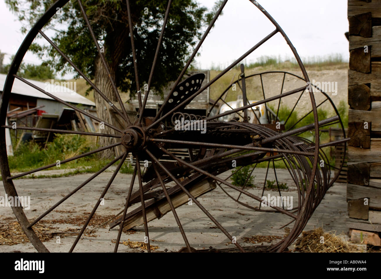 Old farm equipment with rusty metal wheel Stock Photo - Alamy