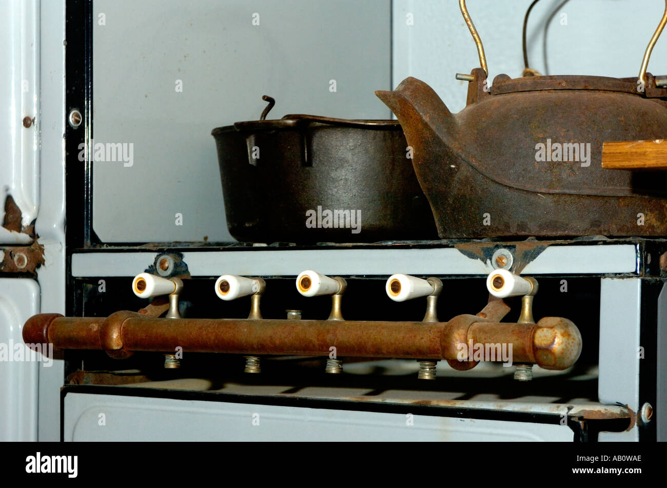 Antique stove with pot on burner Stock Photo - Alamy