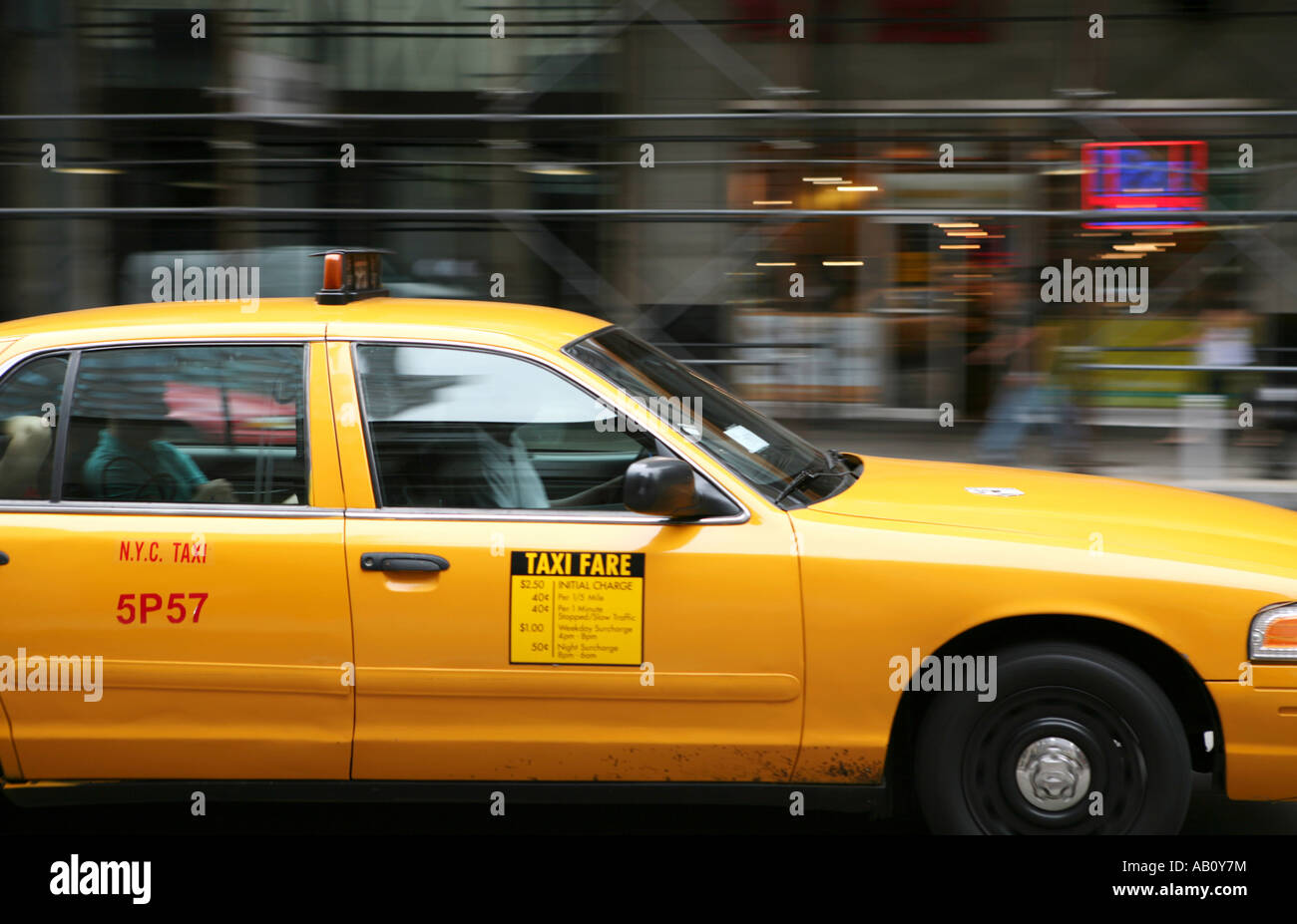 A yellow New York taxi captured with movement blurred background Stock ...