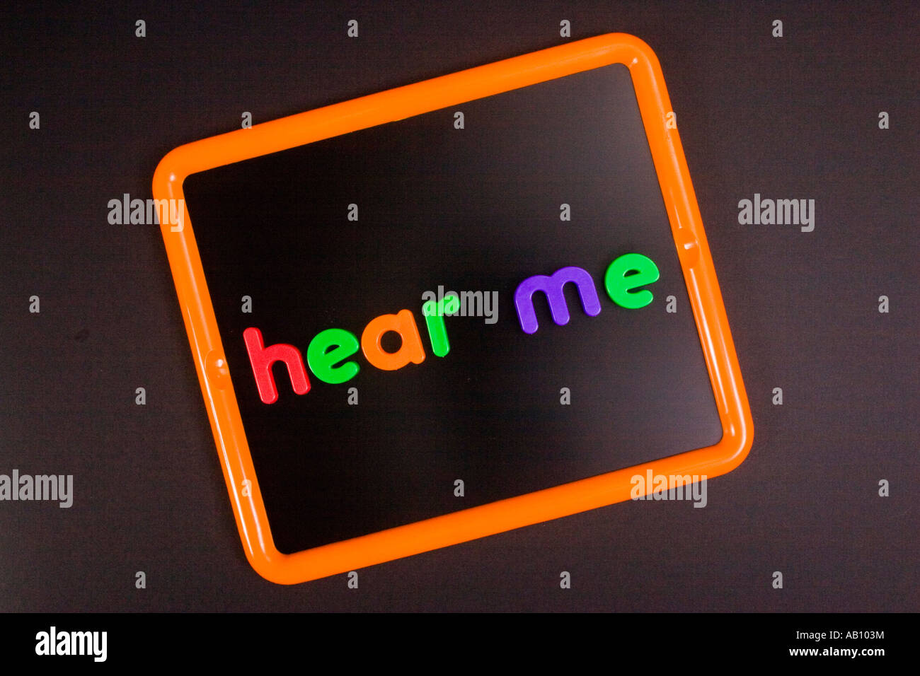 "Hear Me", written with colourful plastic letters on a blackboard Stock ...