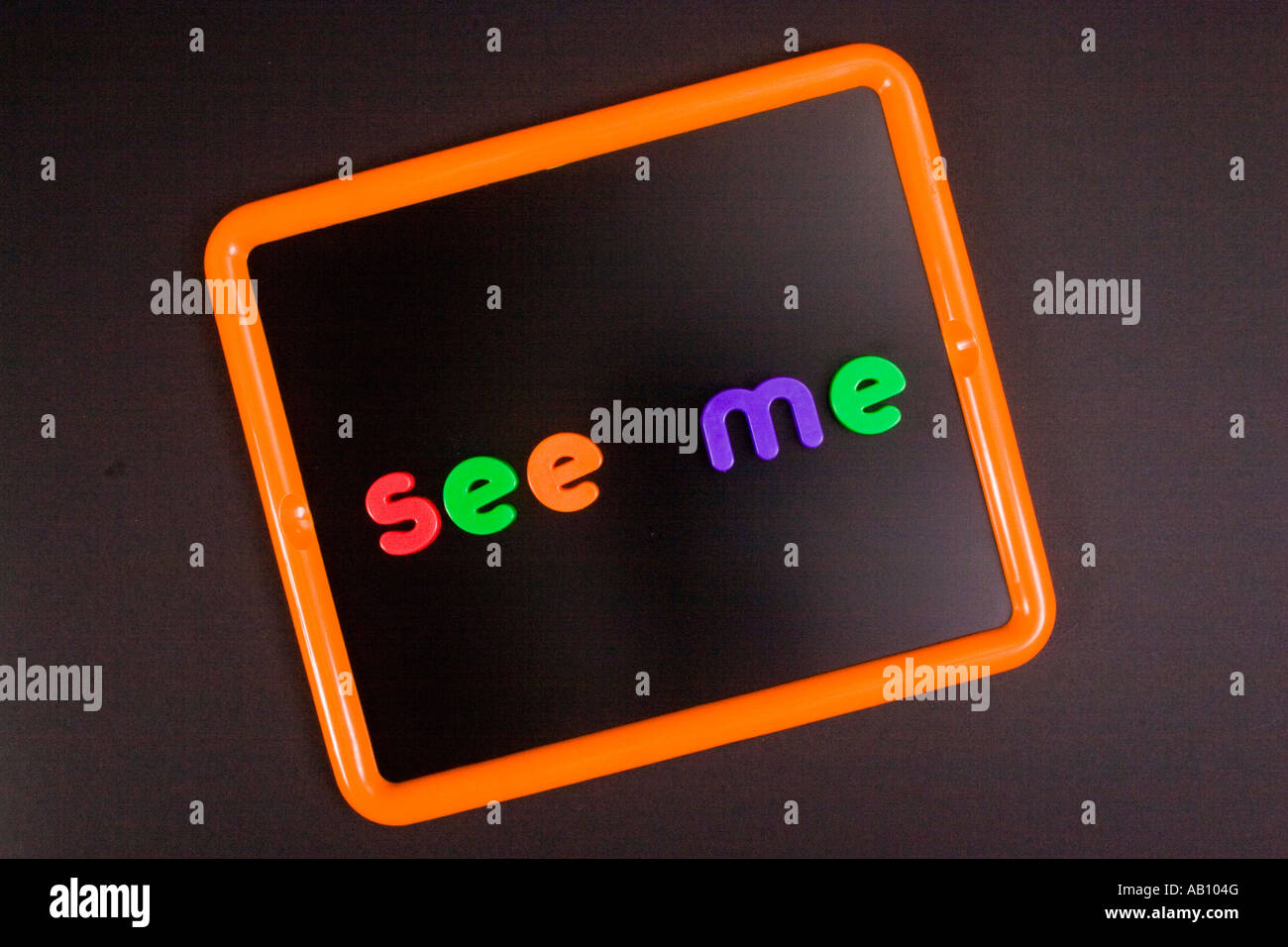 "See Me", written with colourful plastic letters on a blackboard Stock ...