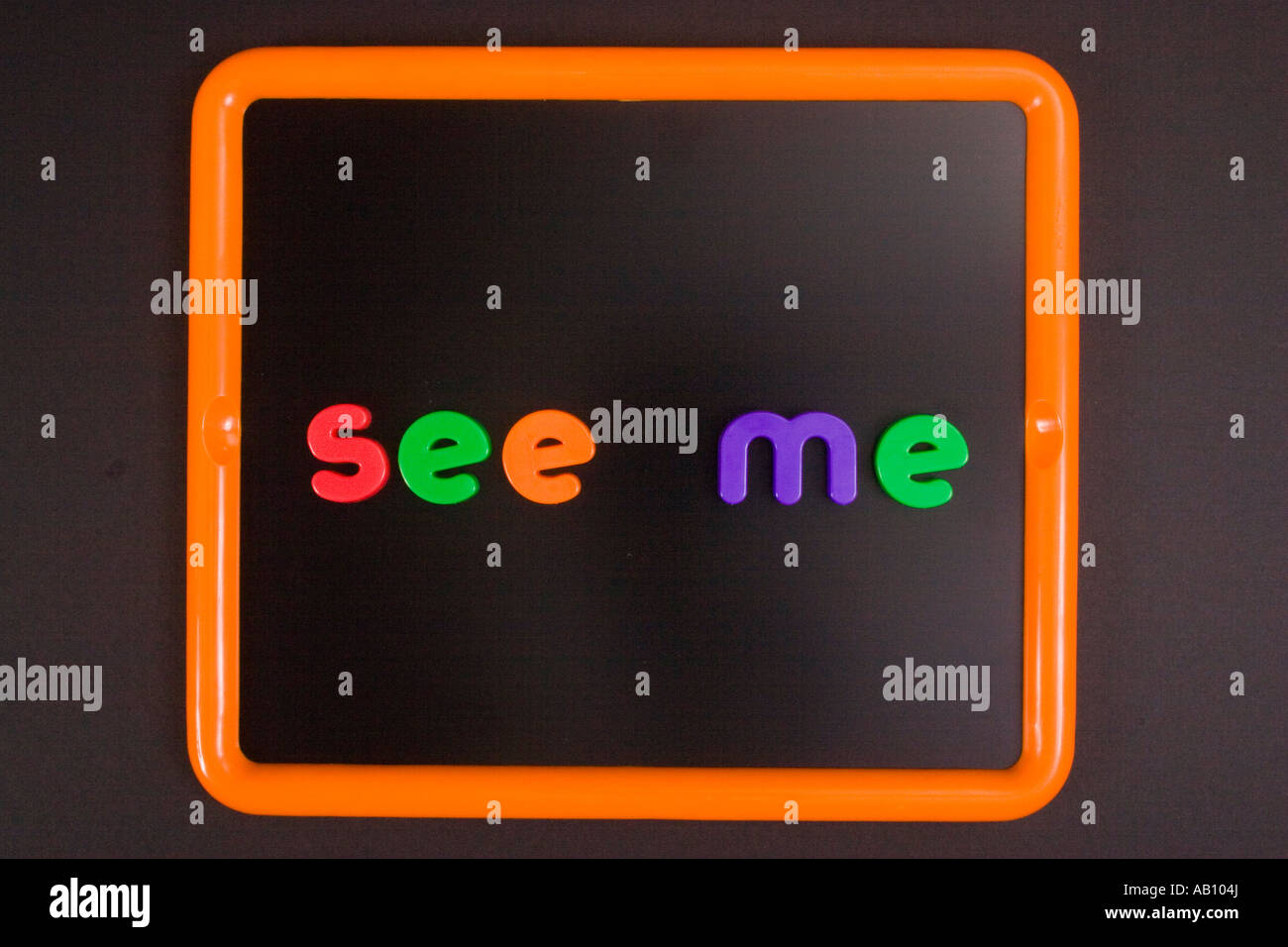 "See Me", written with colourful plastic letters on a blackboard Stock ...
