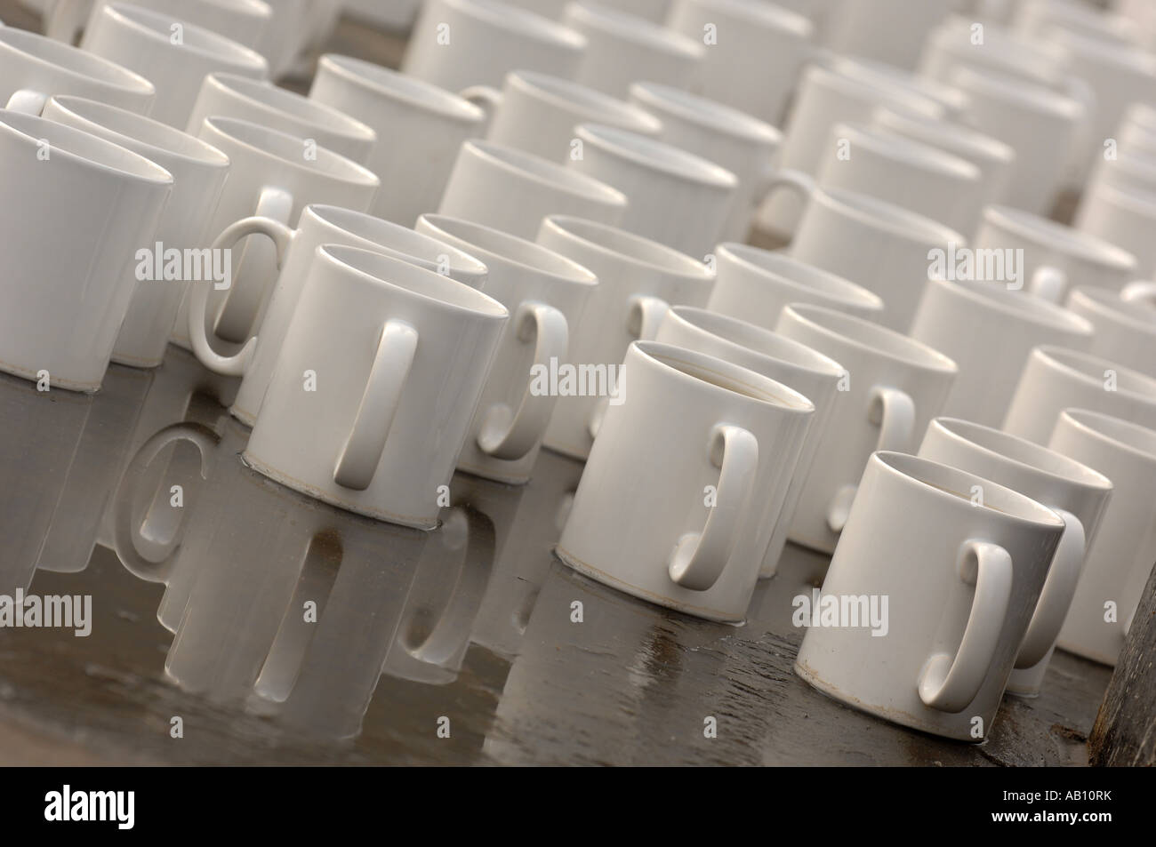 Lines of mugs as an art installation Stock Photo - Alamy