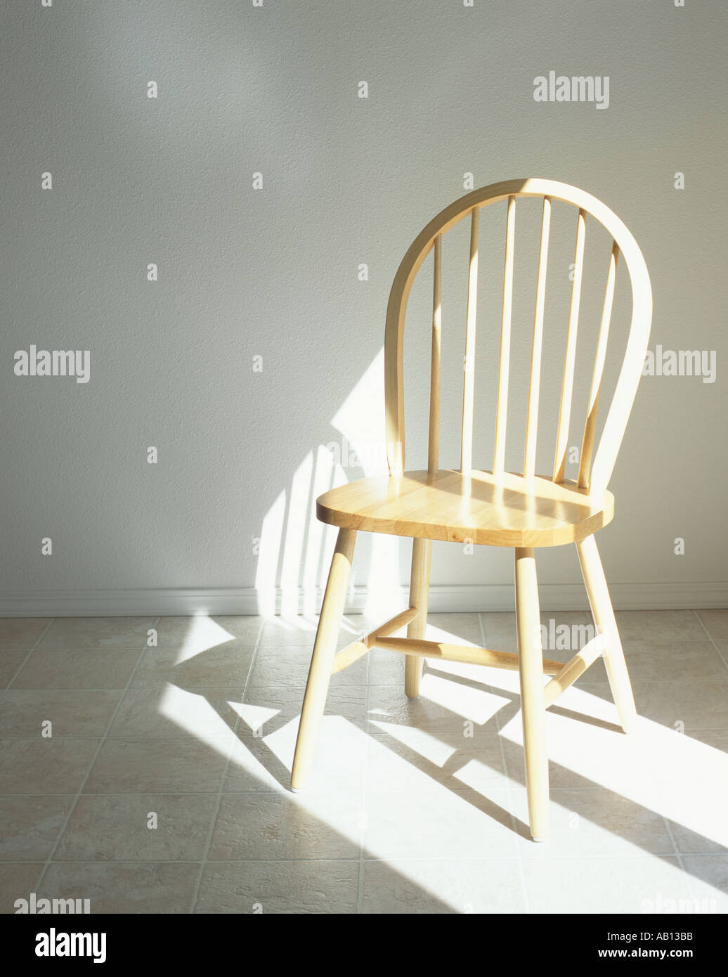 Chair in empty room Stock Photo - Alamy