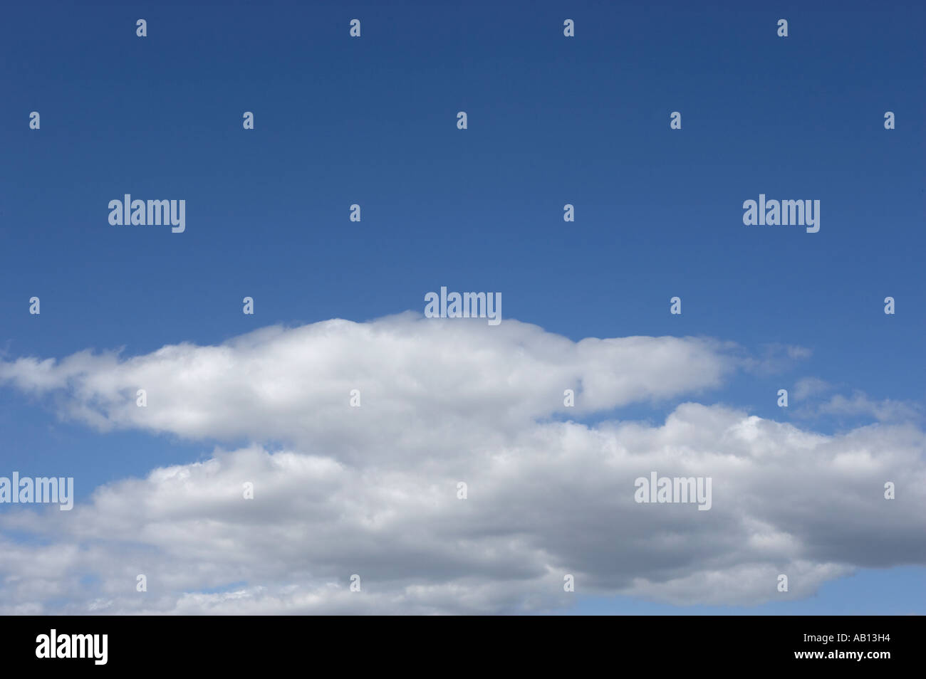 WHITE CLOUDS IN CLEAR BLUE SUMMER SKY Stock Photo - Alamy