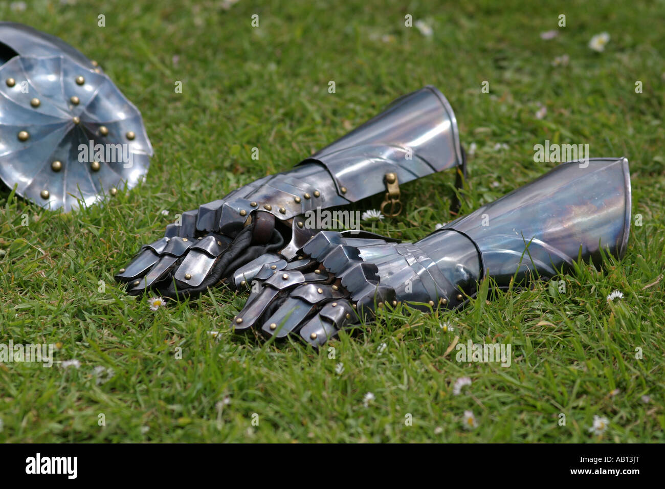 Medieval style gauntlets on grass lawn at jousting tournament Stock ...
