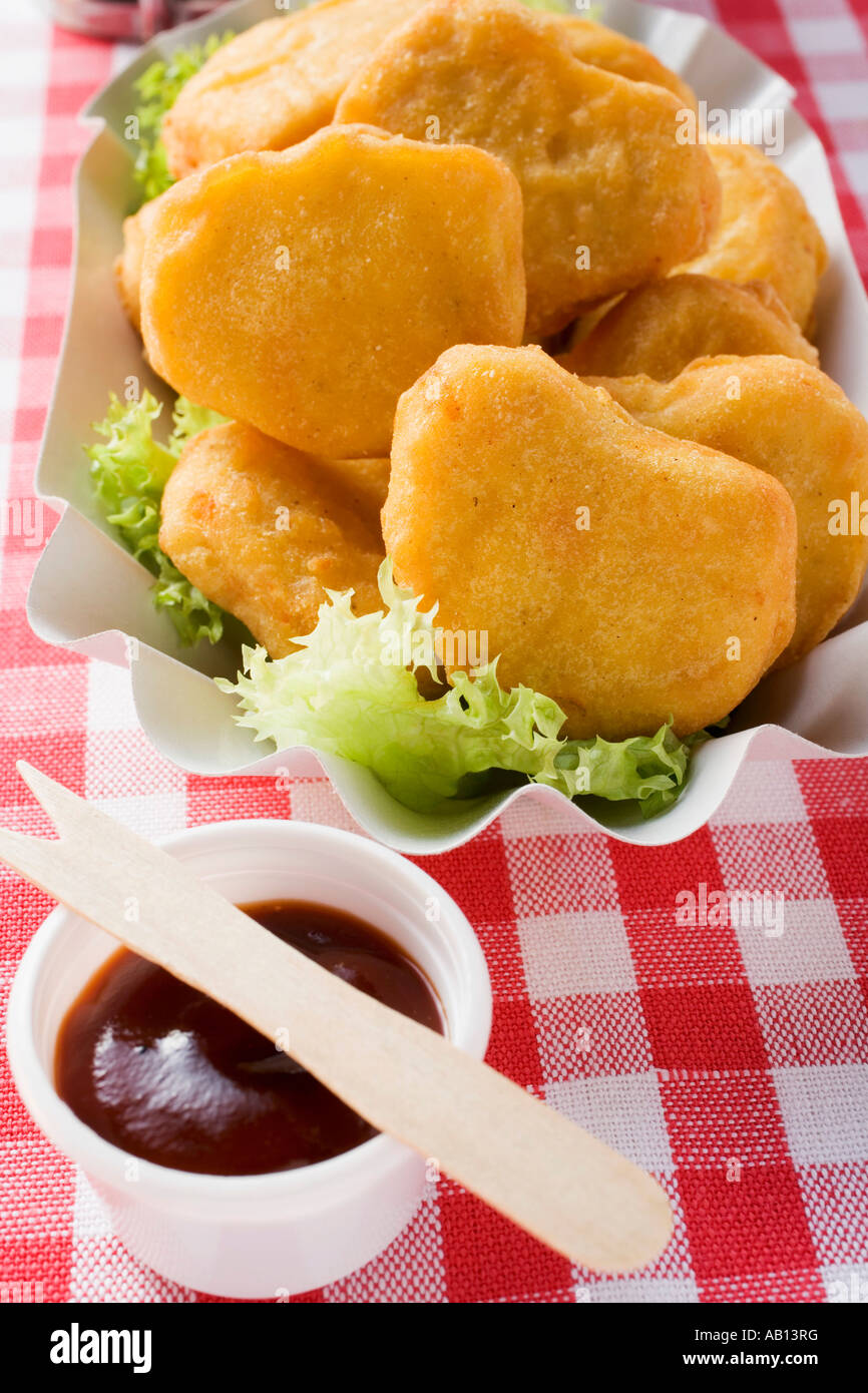 Fish nuggets with ketchup FoodCollection Stock Photo - Alamy