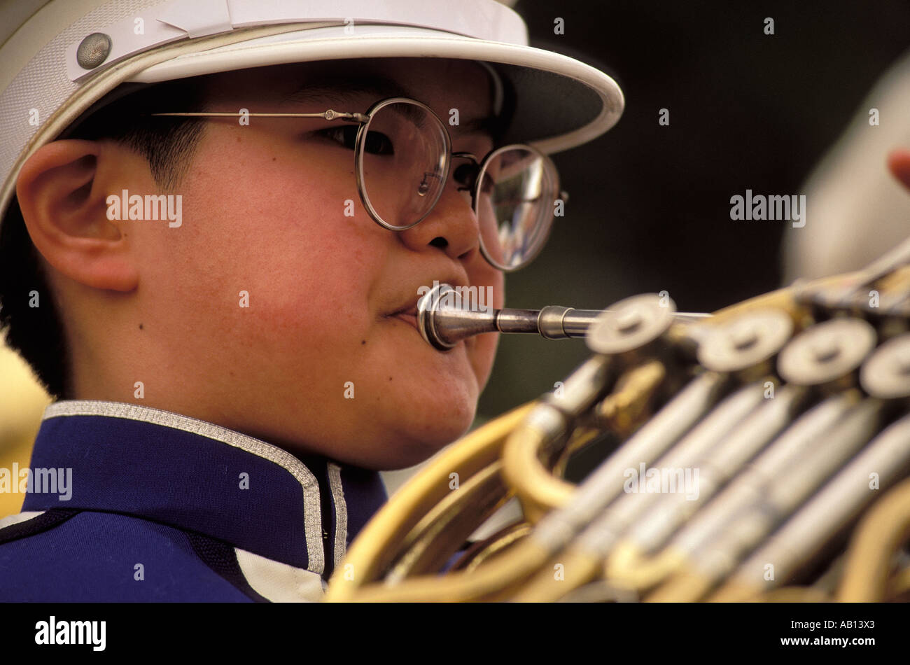 A boy plays the french horn in a parade during the festival of the 47 ...
