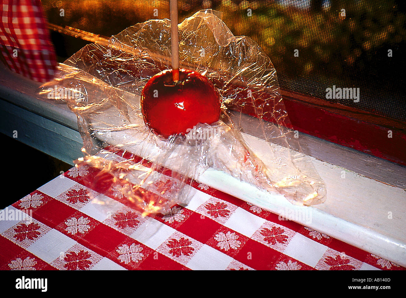 candy apple sitting on window sill Stock Photo - Alamy