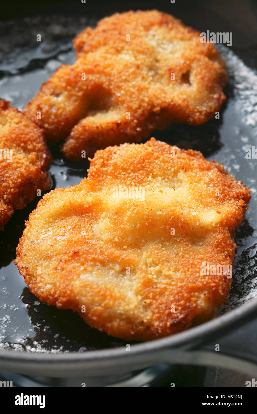 Wiener Schnitzel in frying pan FoodCollection Stock Photo - Alamy