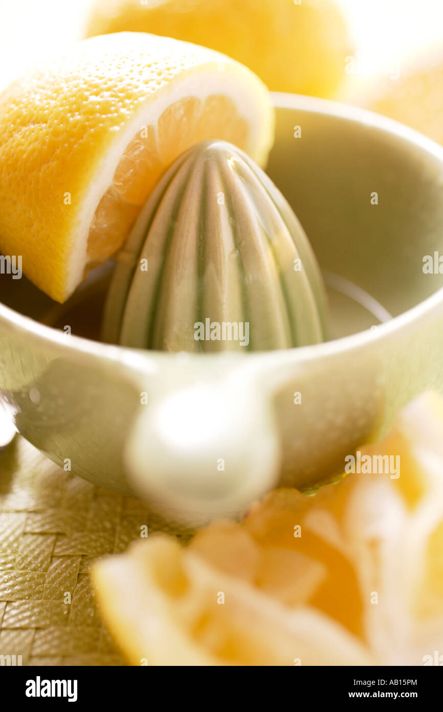 Lemons with lemon squeezer FoodCollection Stock Photo - Alamy
