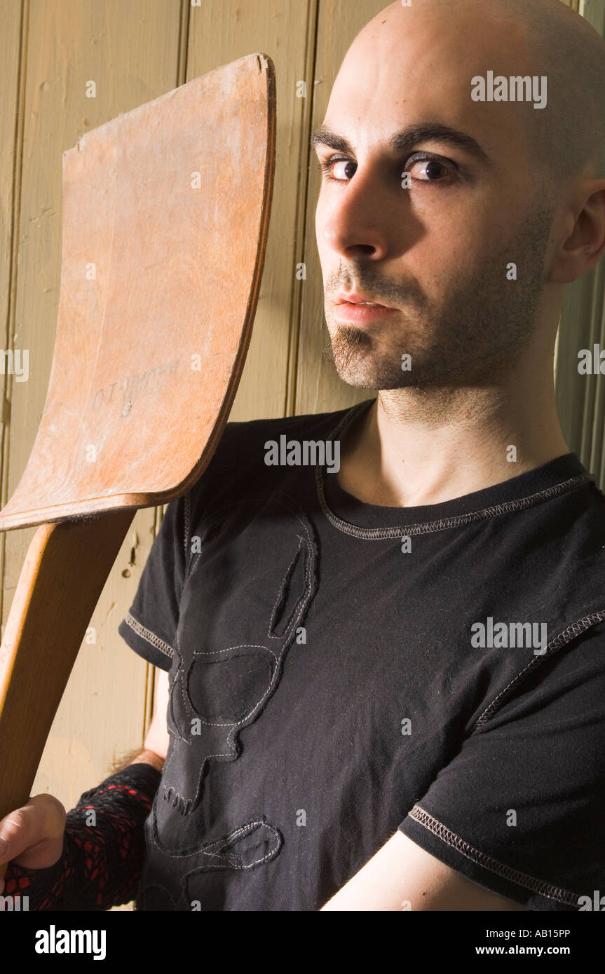 Sinister character with shovel, illuminated by harsh lighting Stock ...