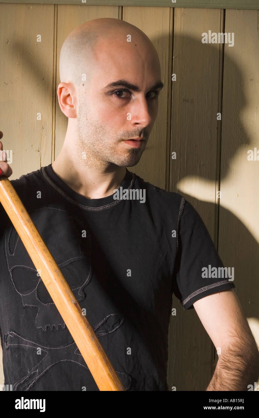 Sinister character with shovel, illuminated by harsh lighting Stock ...