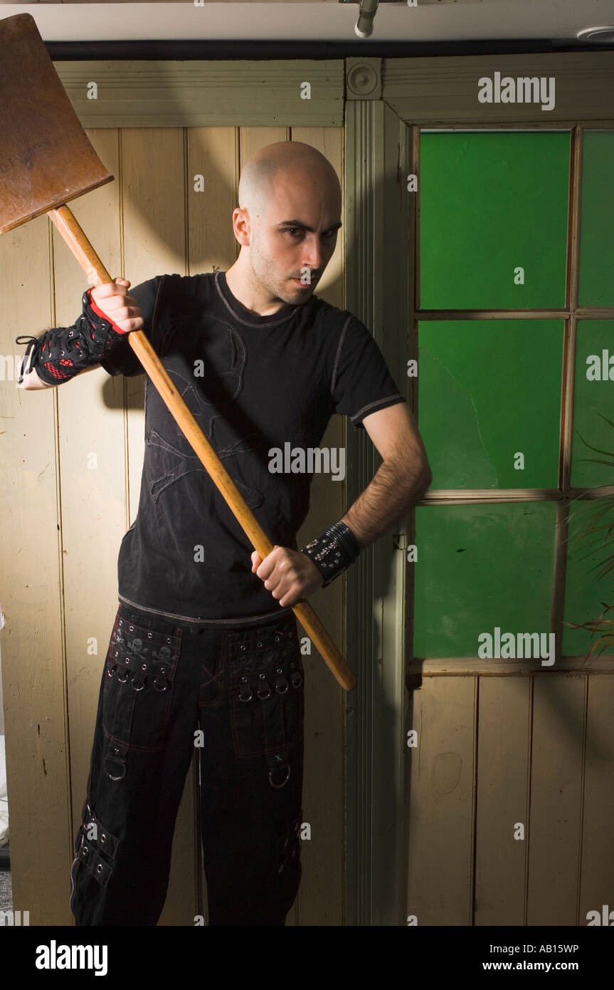 Sinister and angry character illuminated by harsh lighting Stock Photo ...