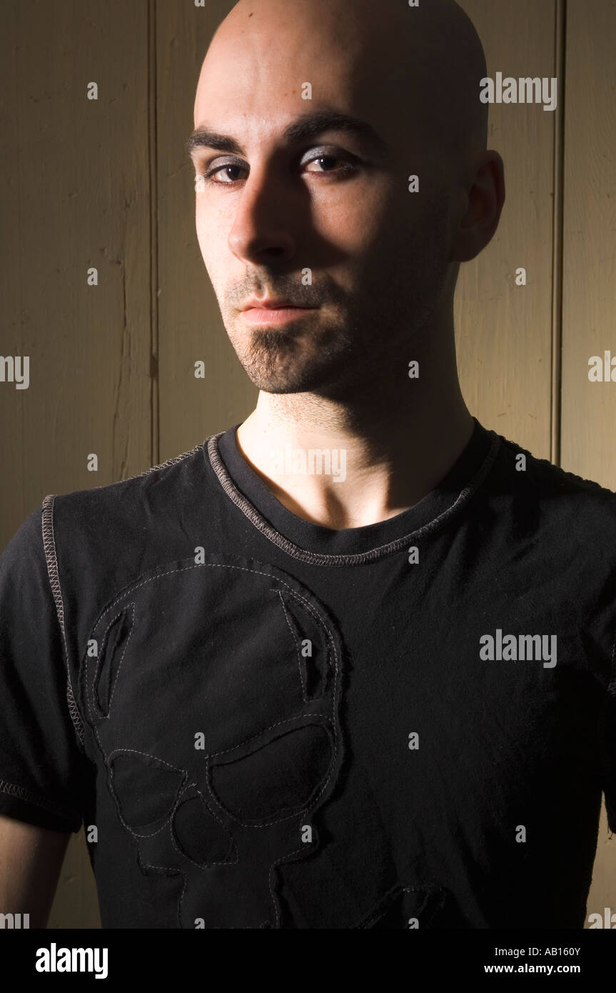 Sinister character illuminated by harsh lighting Stock Photo - Alamy