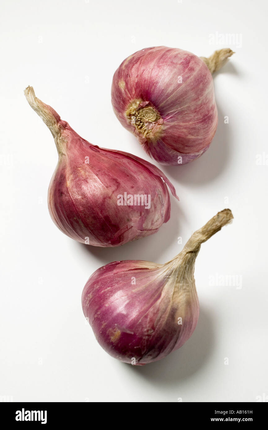 Three red onions FoodCollection Stock Photo - Alamy