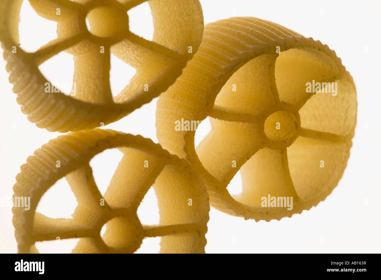 Three pasta wheels detail FoodCollection Stock Photo - Alamy