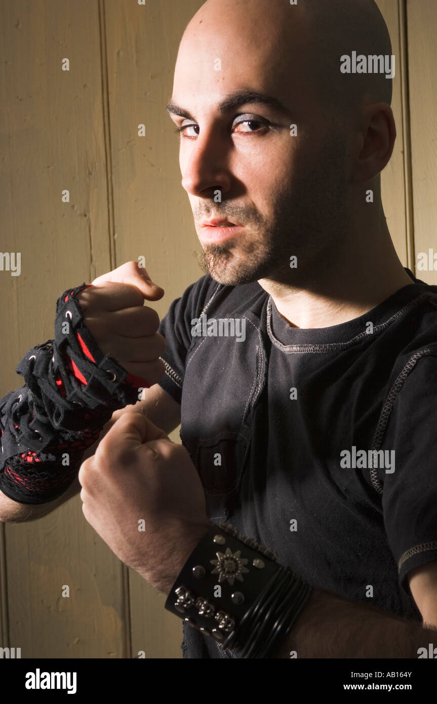 Sinister character illuminated by harsh lighting. Fighting stance Stock ...