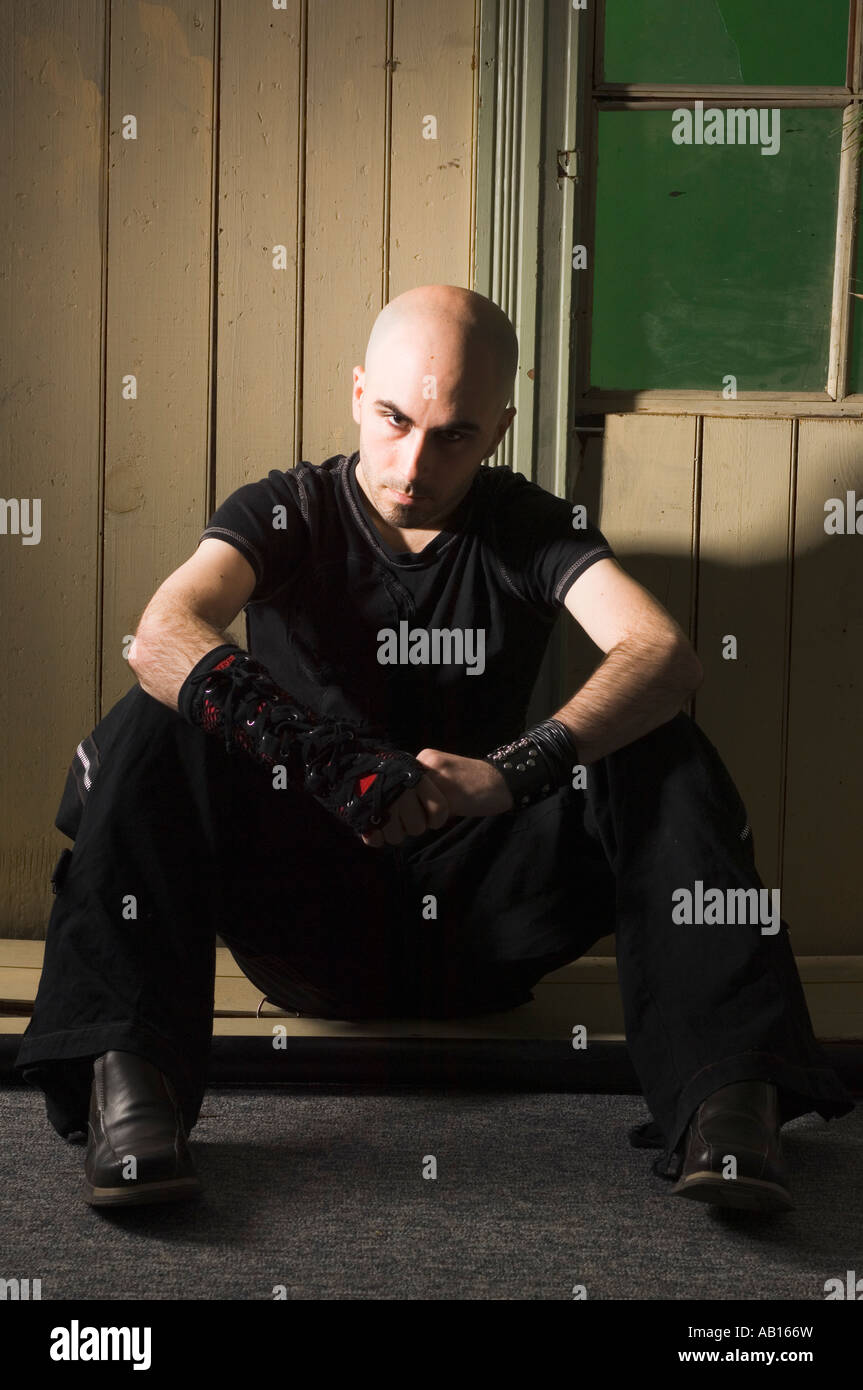 Sinister character illuminated by harsh lighting Stock Photo - Alamy