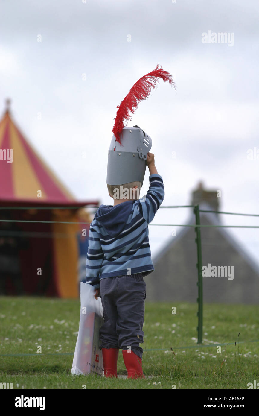 Small boy wearing toy helmet at jousting tournament , Cornwall UK Stock ...