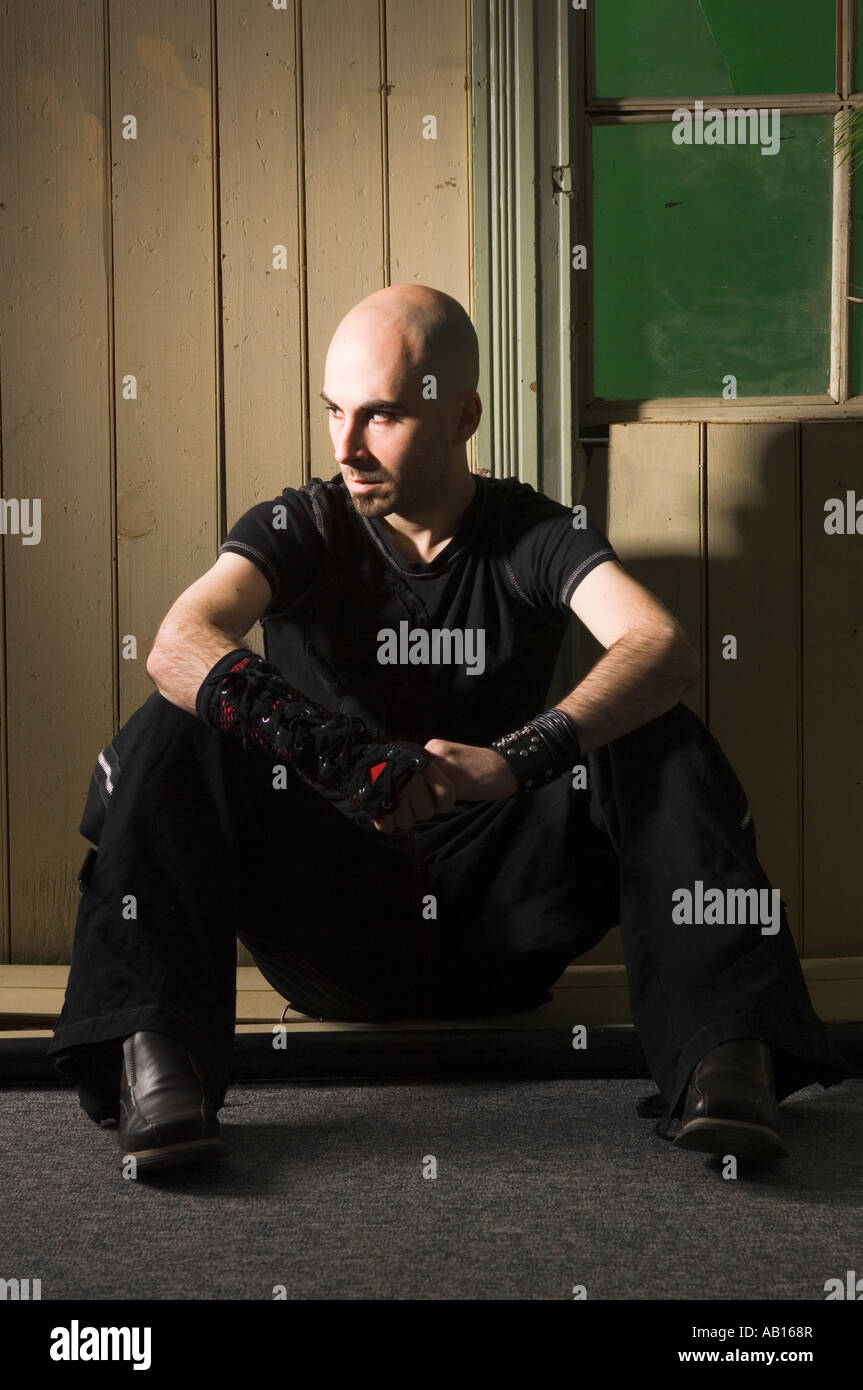 Sinister character illuminated by harsh lighting Stock Photo - Alamy