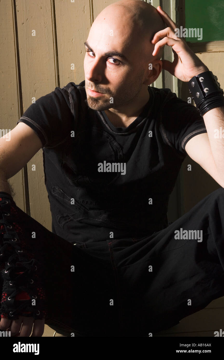 Sinister character illuminated by harsh lighting Stock Photo - Alamy