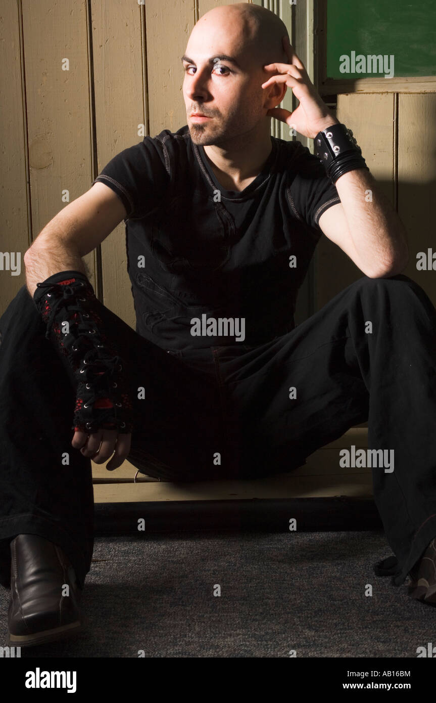 Sinister character illuminated by harsh lighting Stock Photo - Alamy