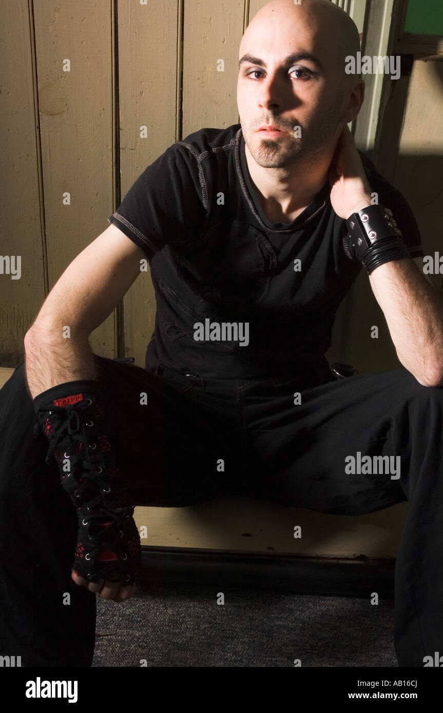 Sinister character illuminated by harsh lighting Stock Photo - Alamy