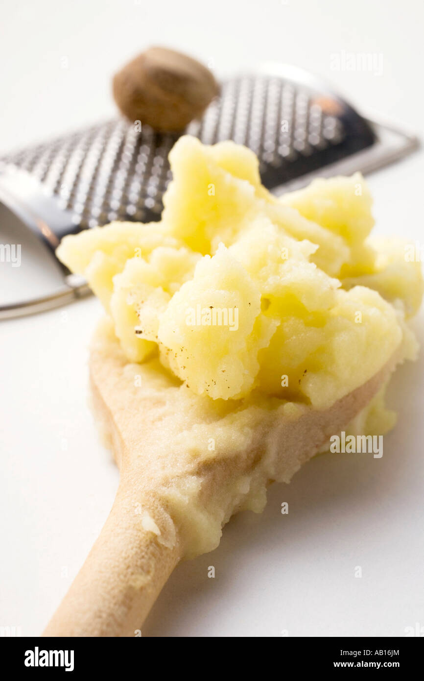 Mashed potato on wooden spoon nutmeg with grater FoodCollection Stock ...