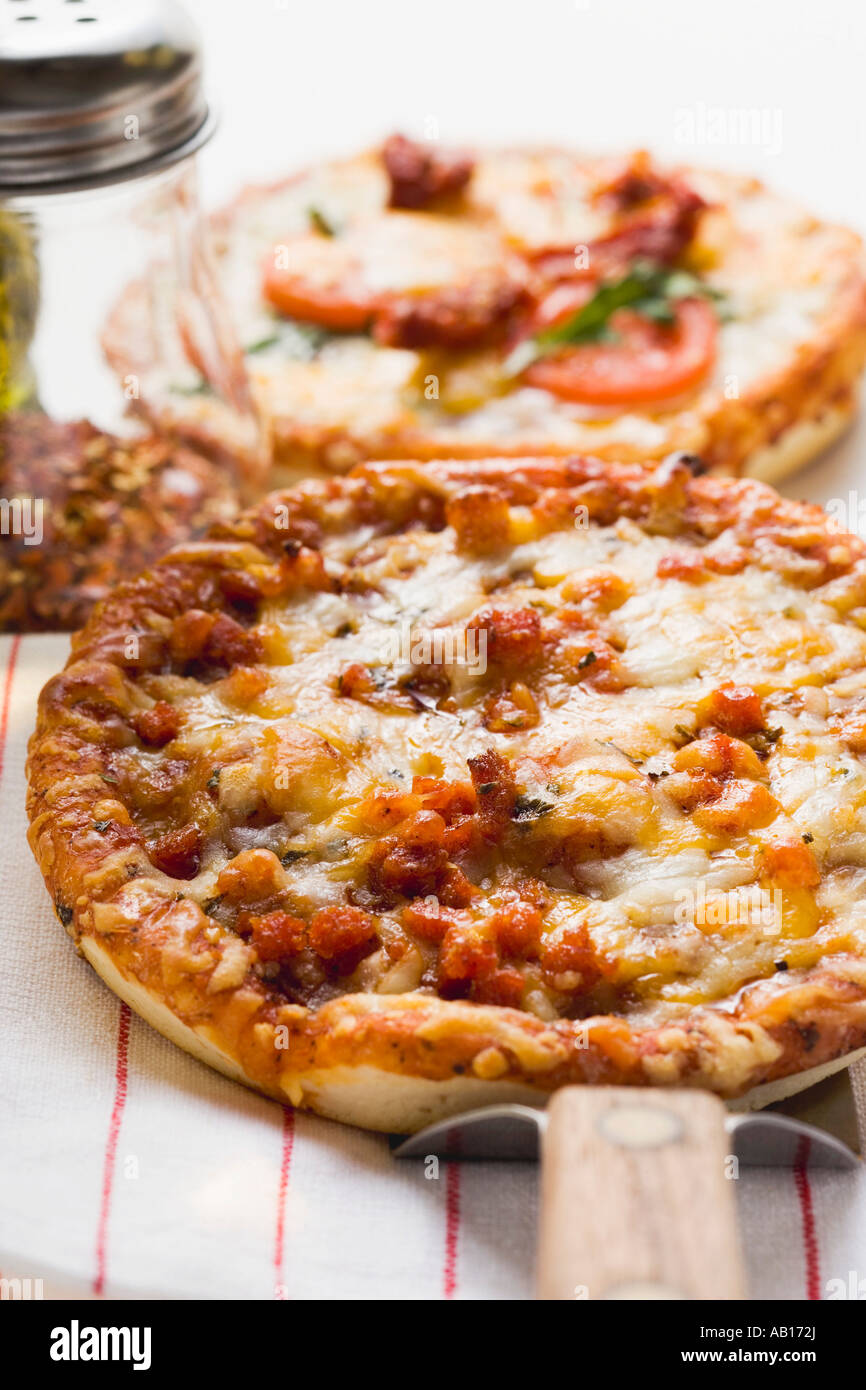 Mini pizza with mince and cheese on server FoodCollection Stock Photo ...