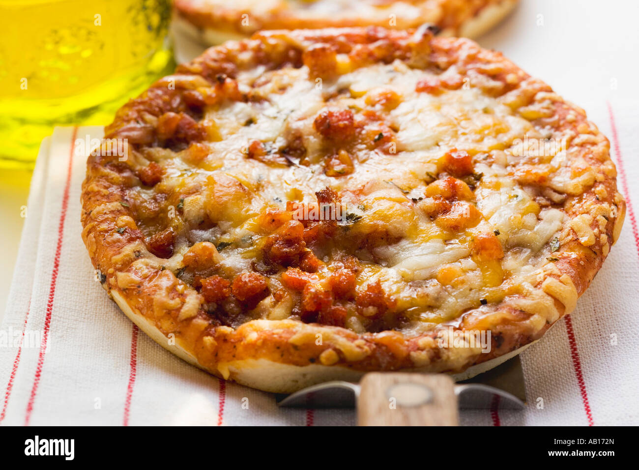 Mini pizza with mince and cheese on server FoodCollection Stock Photo ...