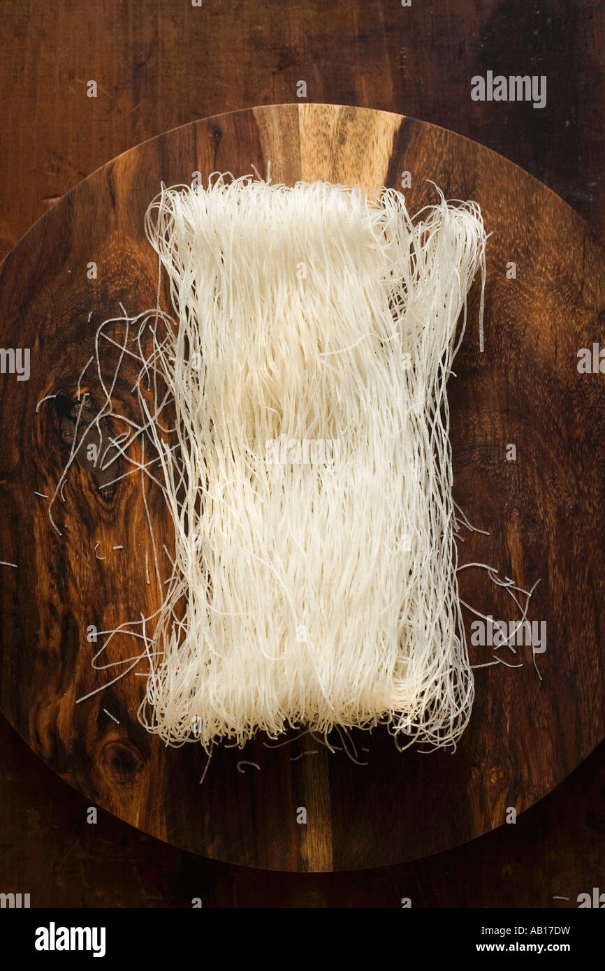 Thin rice noodles on wooden plate FoodCollection Stock Photo - Alamy