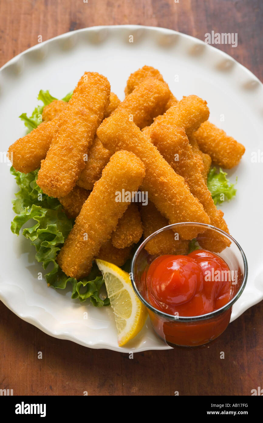 Fish fingers with lemon and ketchup FoodCollection Stock Photo - Alamy
