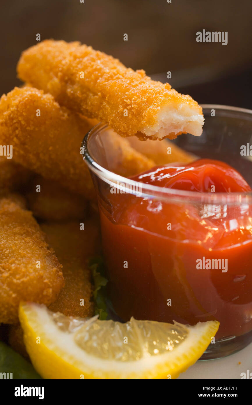 Fish finger with ketchup a bite taken FoodCollection Stock Photo - Alamy