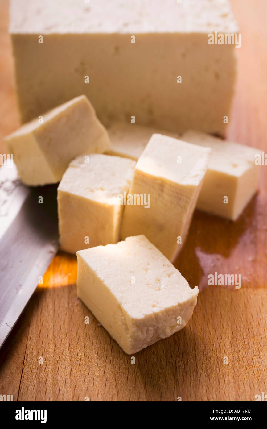 Block of tofu diced tofu and Asian knife FoodCollection Stock Photo - Alamy