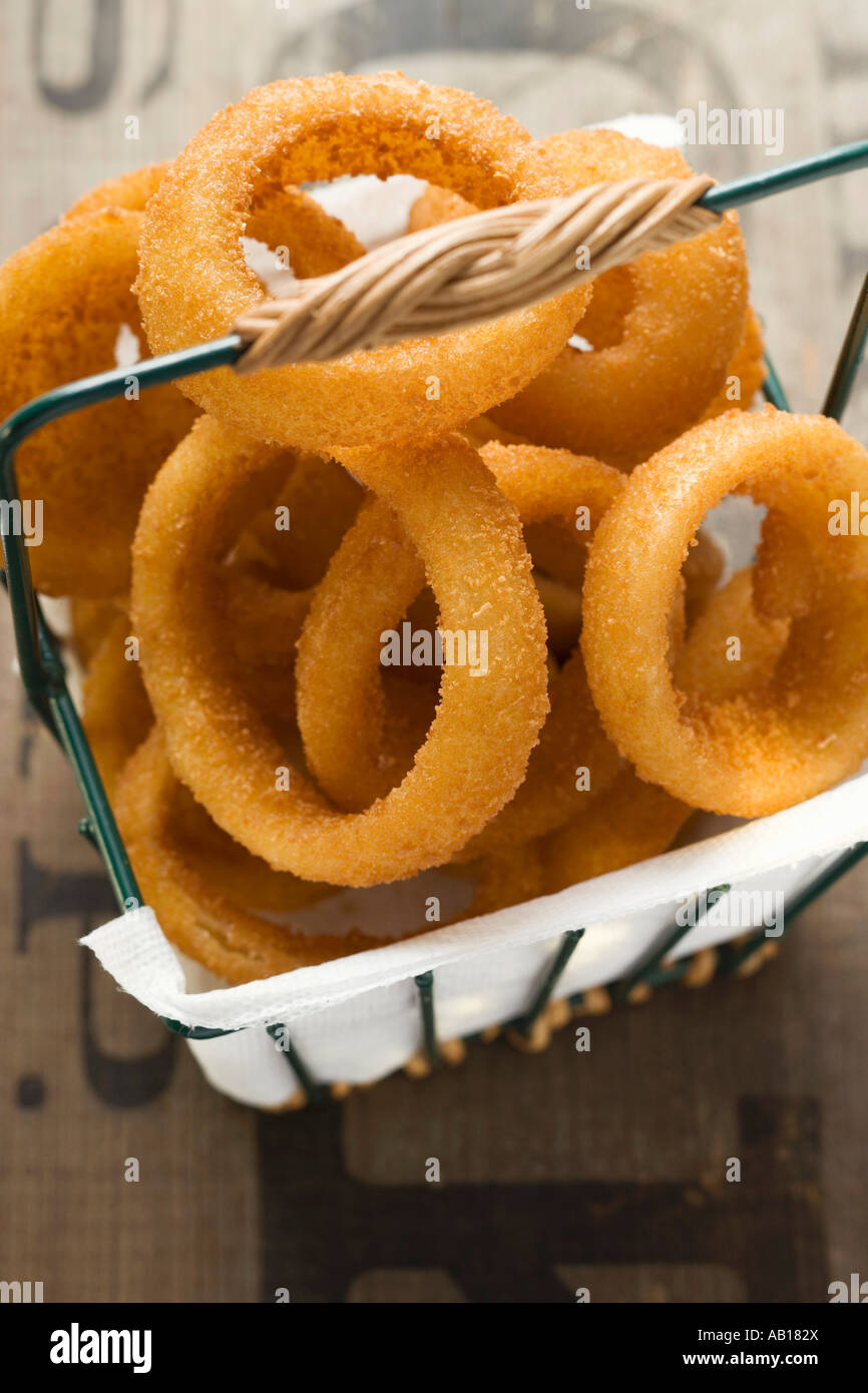 Deep fried onion rings in a wire basket FoodCollection Stock Photo - Alamy