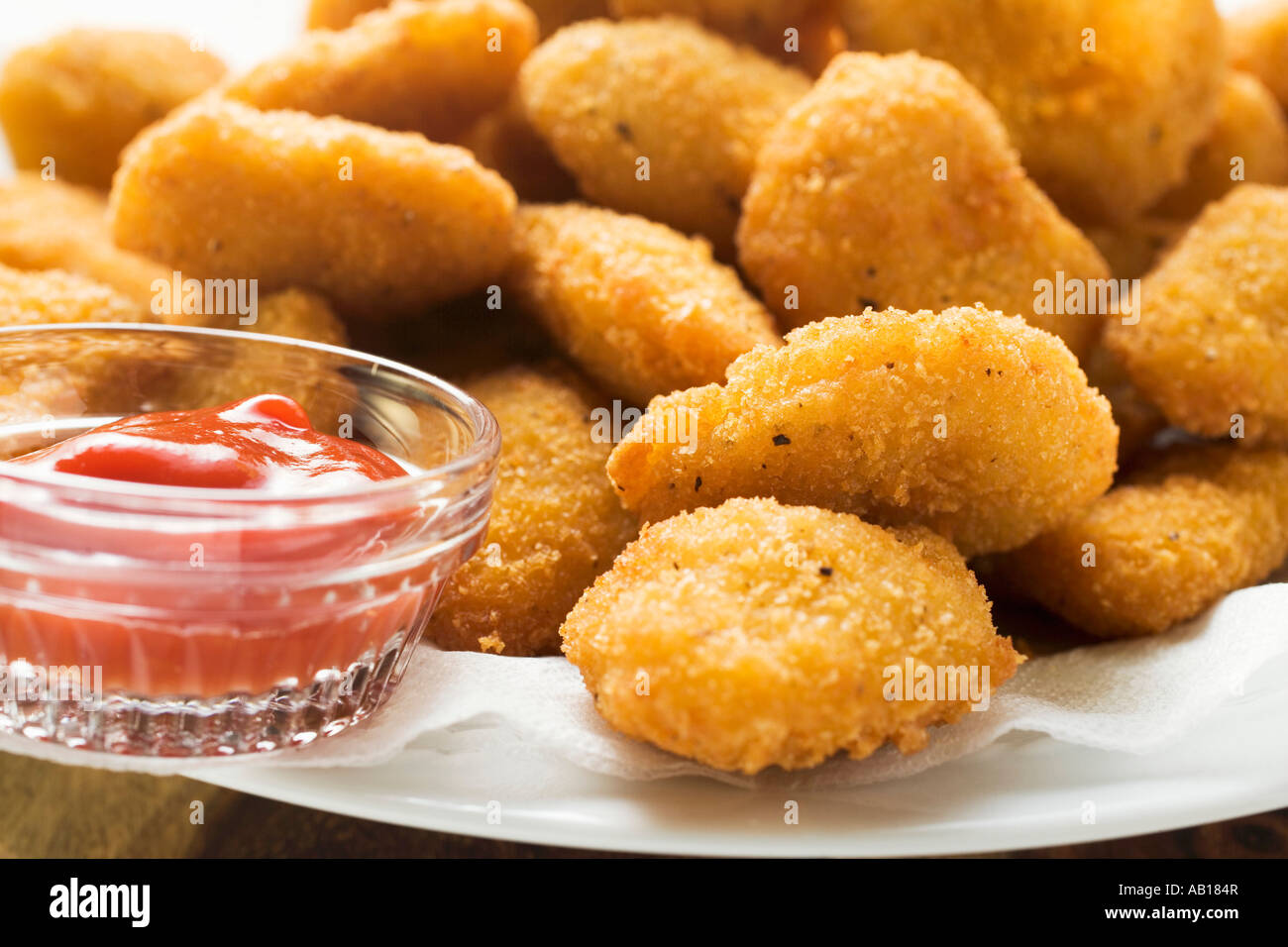 Many chicken nuggets with ketchup on plate FoodCollection Stock Photo ...