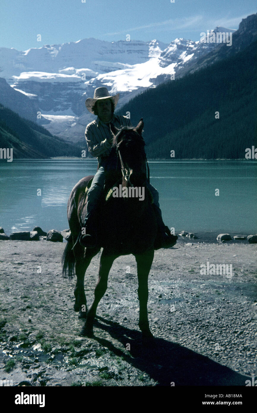Midnight cowboy: horse and rider silhouetted against the Rockies, Lake ...