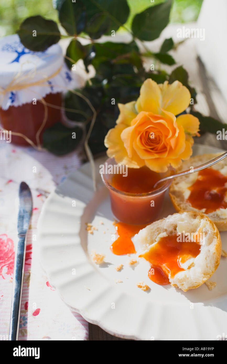 Rose hip jam on bread roll yellow rose FoodCollection Stock Photo - Alamy