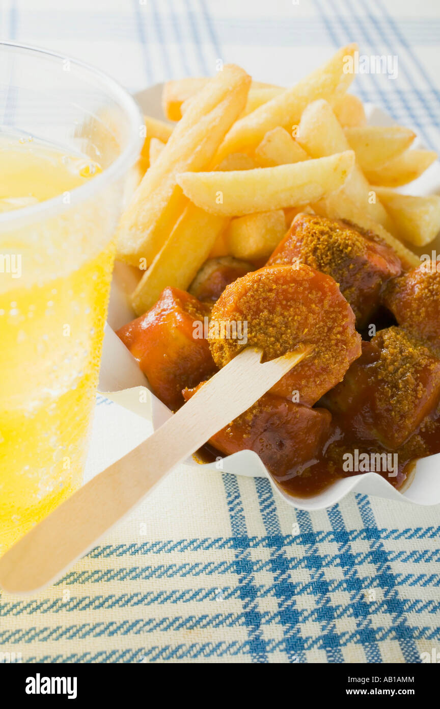 Currywurst sausage with ketchup curry powder chips lemonade ...