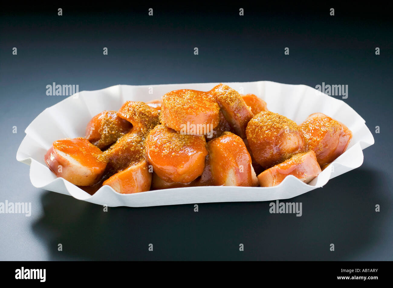 Currywurst sausage with ketchup curry powder in paper dish ...