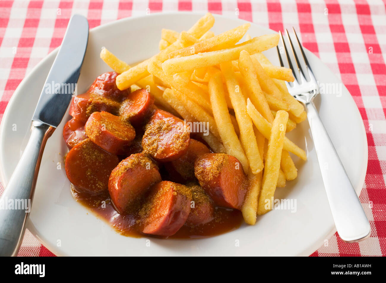 Currywurst sausage with ketchup curry powder and chips FoodCollection ...